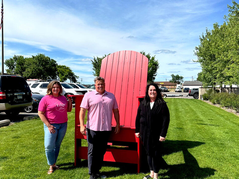 Big red chair, picnic tables donated