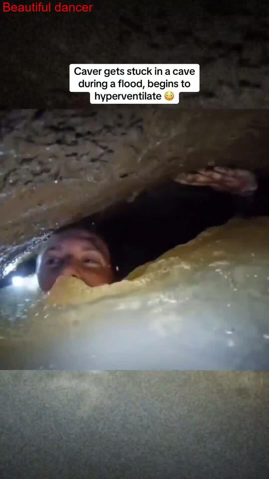 Cave explorers venture into a cave during a flash flood and are ...