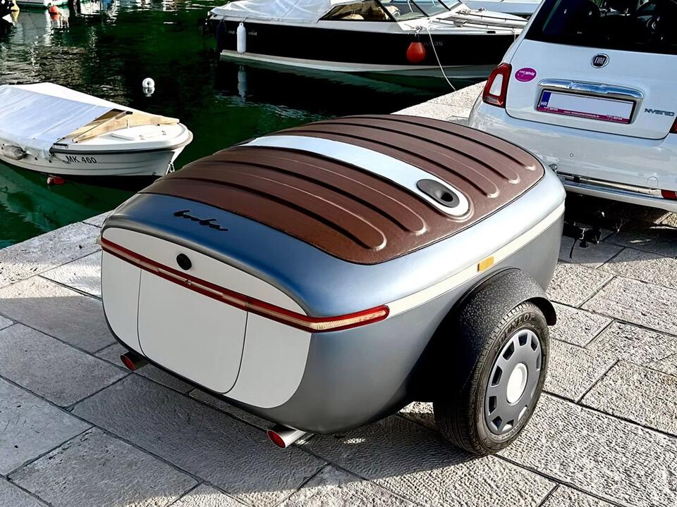 This compact trailer’s clamshell design unfolds and inflates into cozy ...