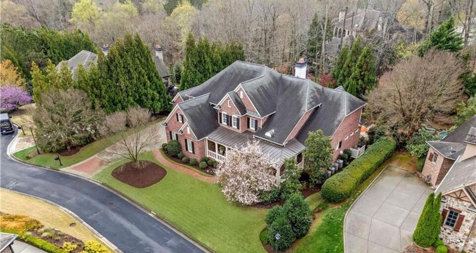 Explore Refined Living in this 8,389 Sq. Ft. Brick Estate in a Gated ...