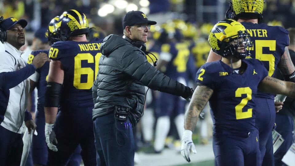 Michigan football coach defends players amid cheating allegations ...