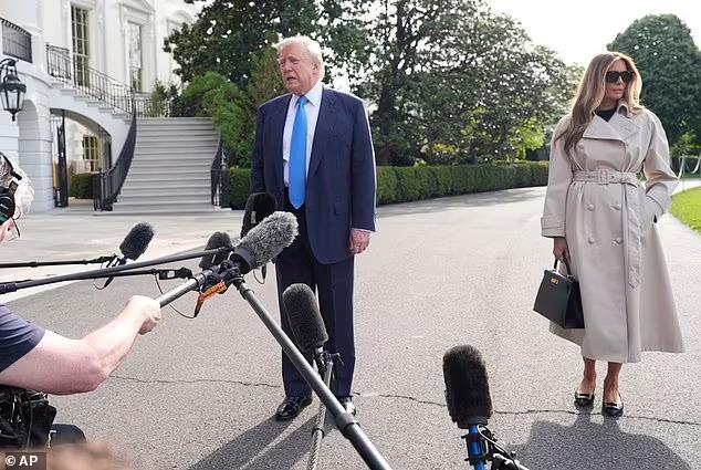 Trump and Melania enjoy VERY rare moment of romance as pair head to ...