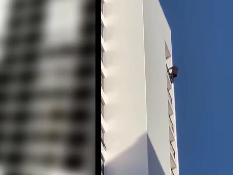 Crisis negotiators respond to man clinging from high-rise ledge in Waikiki