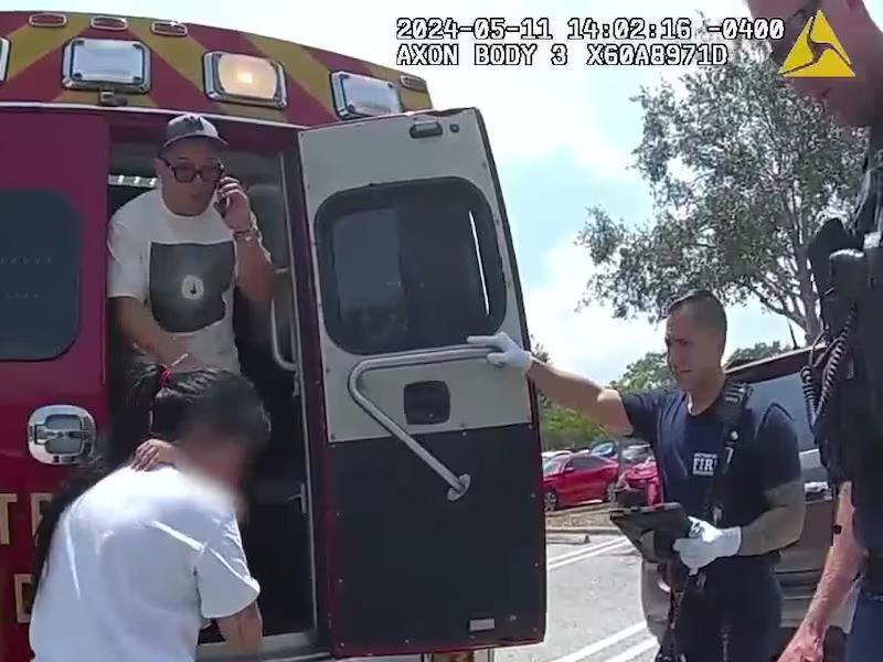 Police body camera video shows firefighters tending to girl after ...