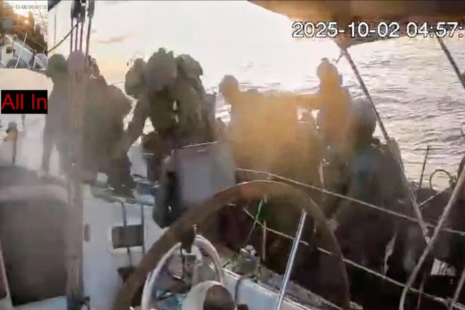 Israeli navy intercepts most flotilla boats and arrests activists. A ...
