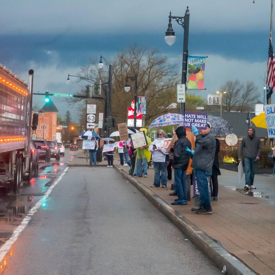 Photos: Rain-soaked anti-Trump protest - NewsBreak