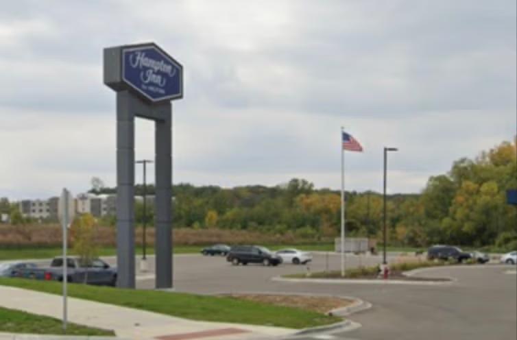 Crane removes Hampton Inn Hilton sign at hotel accused of denying entry ...
