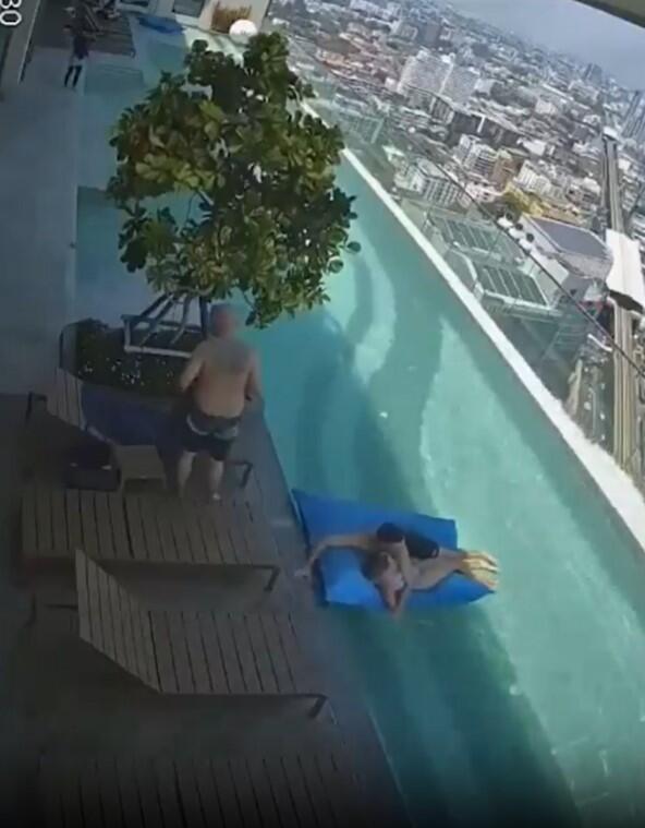 Watch terrifying moment swimmer is nearly swept off roof in Bangkok as ...