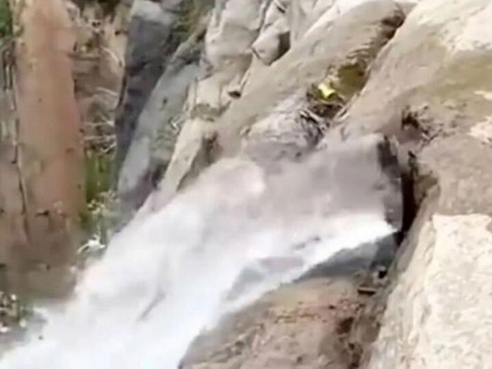 China's famous plunging waterfall appears to flow from man-made pipe ...