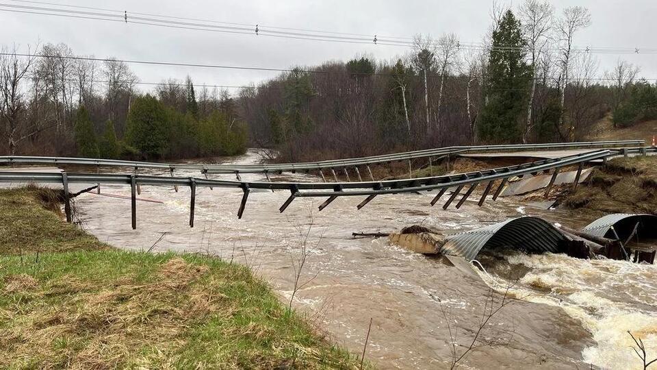 Flooding leads to bridge failure, road closures in Grand Traverse ...