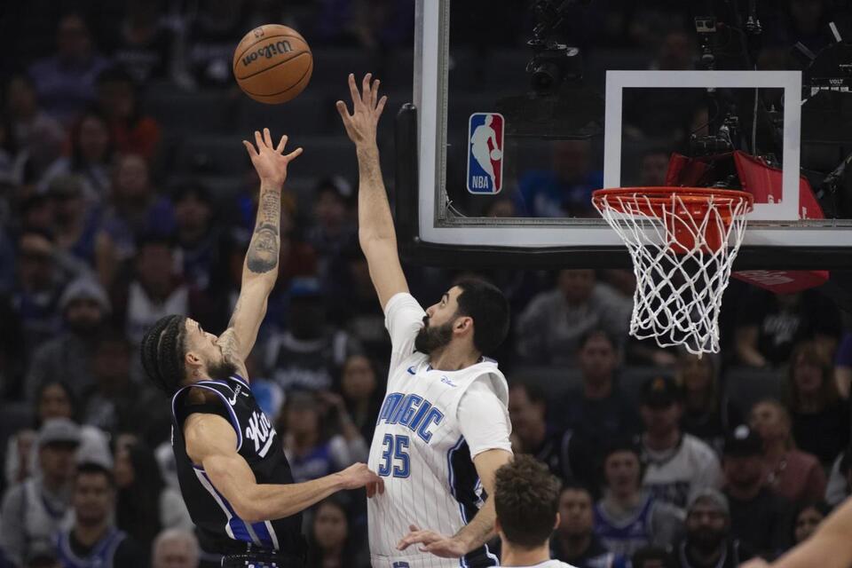 Kings outlast short-handed Magic in double overtime behind triple ...