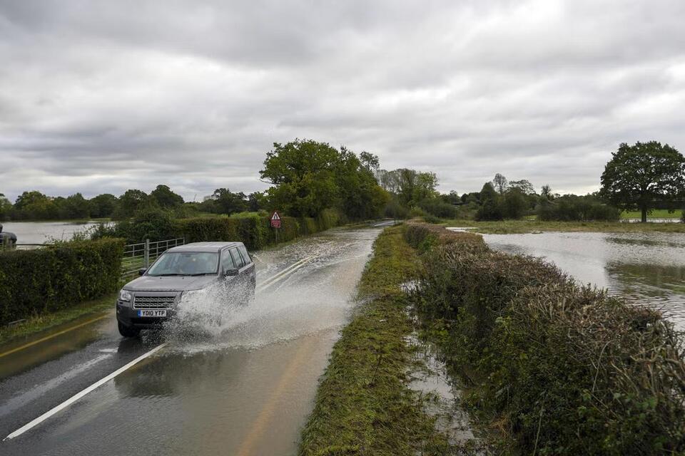Three people rescued from vehicles as heavy rain causes floods - NewsBreak
