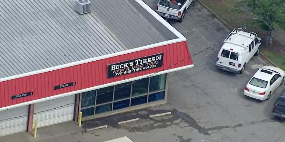 Man dies after being pinned under vehicle at tire shop, officials say ...