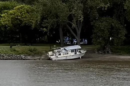 Authorities work with boat owner to get beached craft off Harriet ...