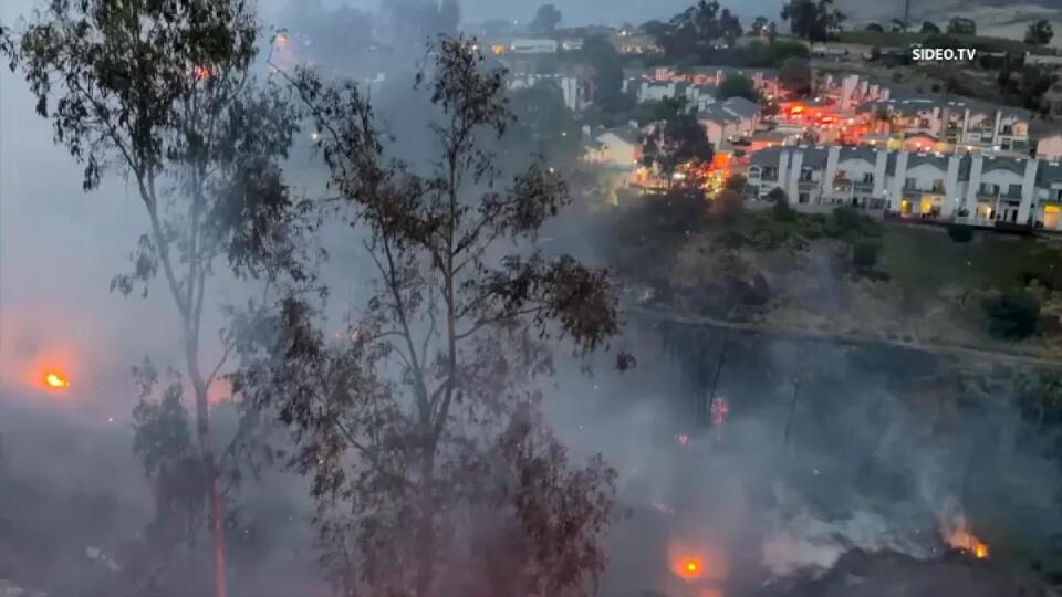 One person detained after brush fire causes temporary evacuations in ...