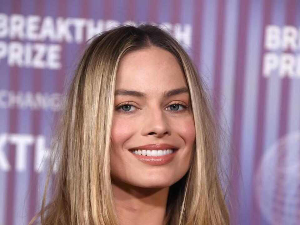 Margot Robbie Went Full On ‘Corp-core’ In A $1,350 Suit