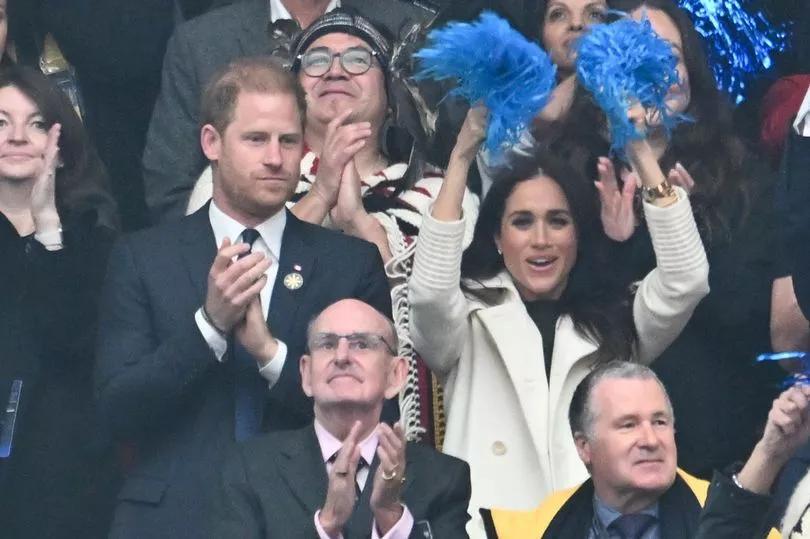 Meghan Markle and Prince Harry watch from the stands as Katy Perry ...