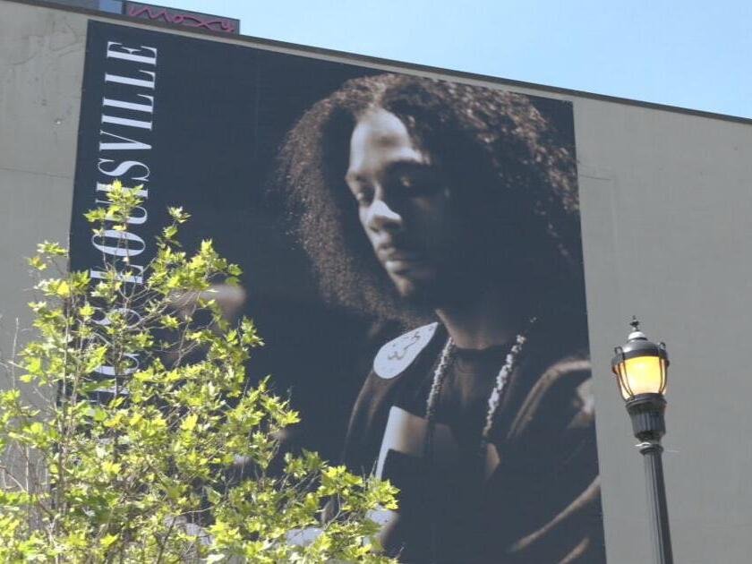 Hometown Hero banner unveiled for Static Major in downtown Louisville