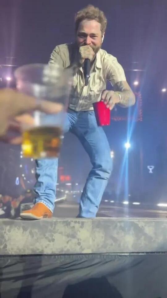 Watch the shocking moment Post Malone falls off stage mid-gig – leaving ...