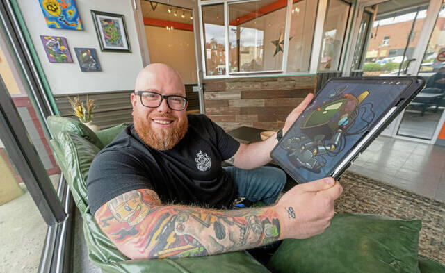 Tattoo artist plans new studio, community hub at former Manos Gallery ...