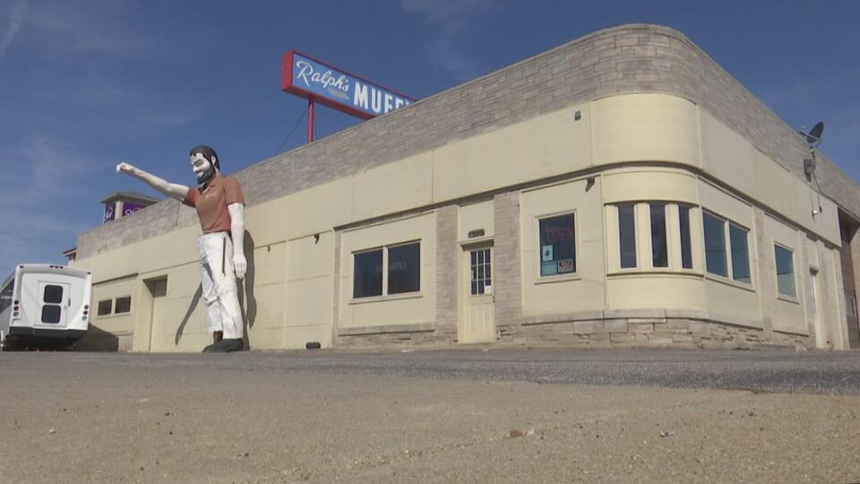 Indy's roadside muffler man 'injured' in hit-and-run - NewsBreak