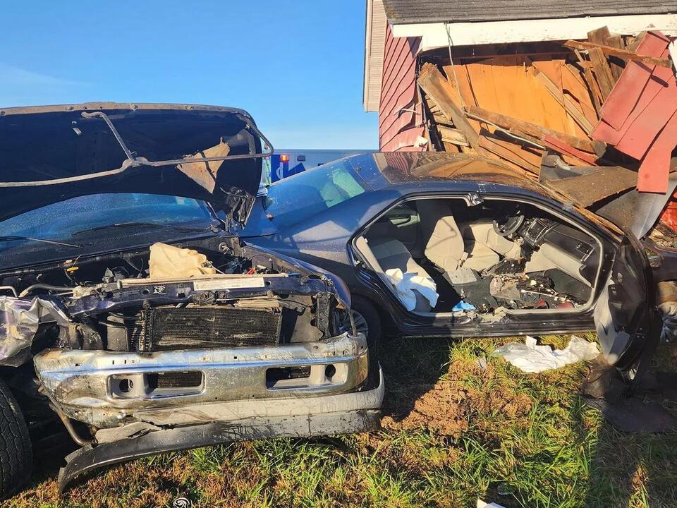Car & pickup truck crash into barn in Scotland County