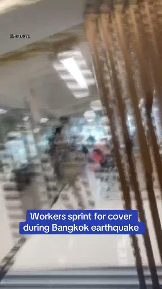 Terrifying footage shows the moment workers ran for cover as a 7.7 magnitude earthquake hit ...