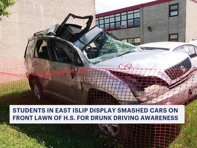 Students in East Islip display smashed cars on front lawn of high ...