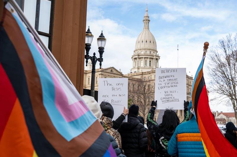 People protest Trump's actions at Lansing capitol building - NewsBreak