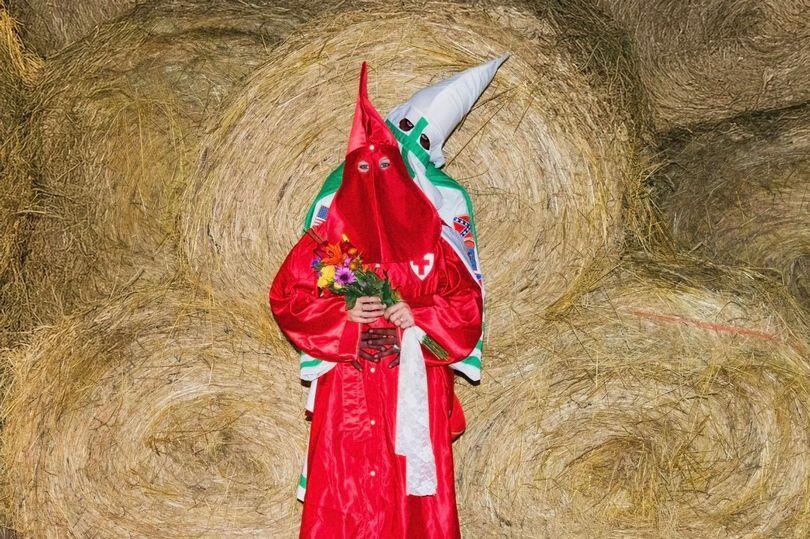 Kanye West poses with mystery woman in matching KKK hoods after Bianca ...