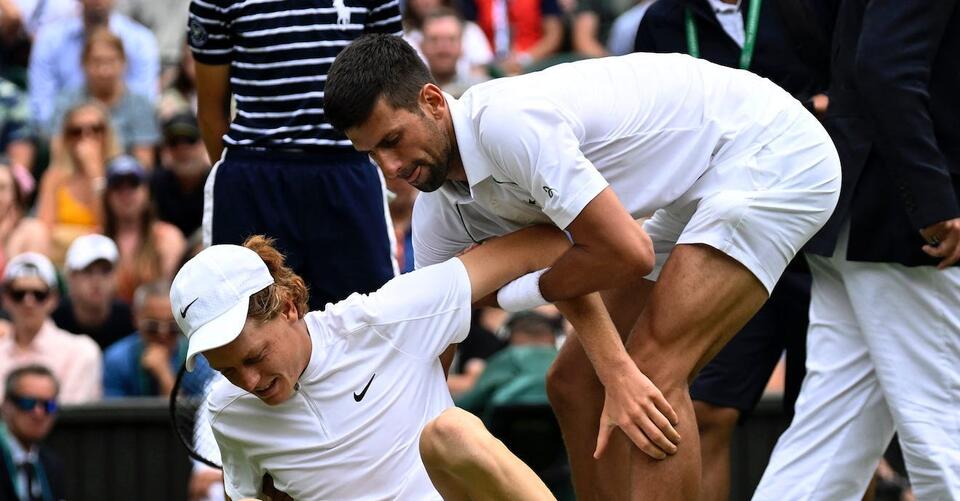 Novak Djokovic climbed over the net and picked up his opponent after he ...