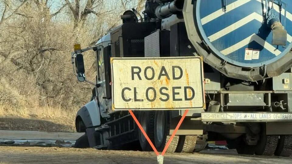 Water main break causes road damage; multiple houses flooded near ...