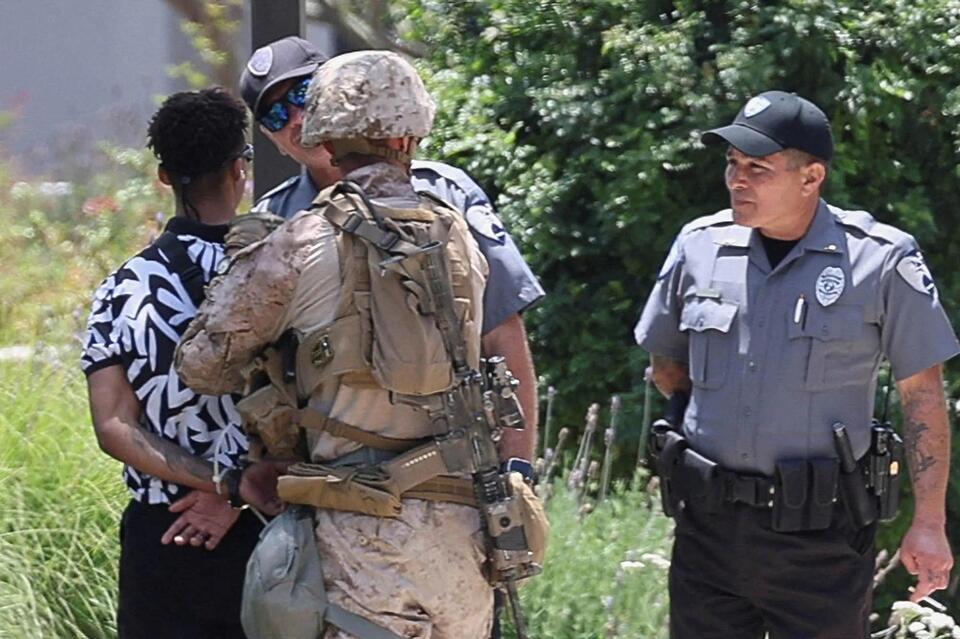US Marines temporarily detain a civilian — an Army veteran — for the ...
