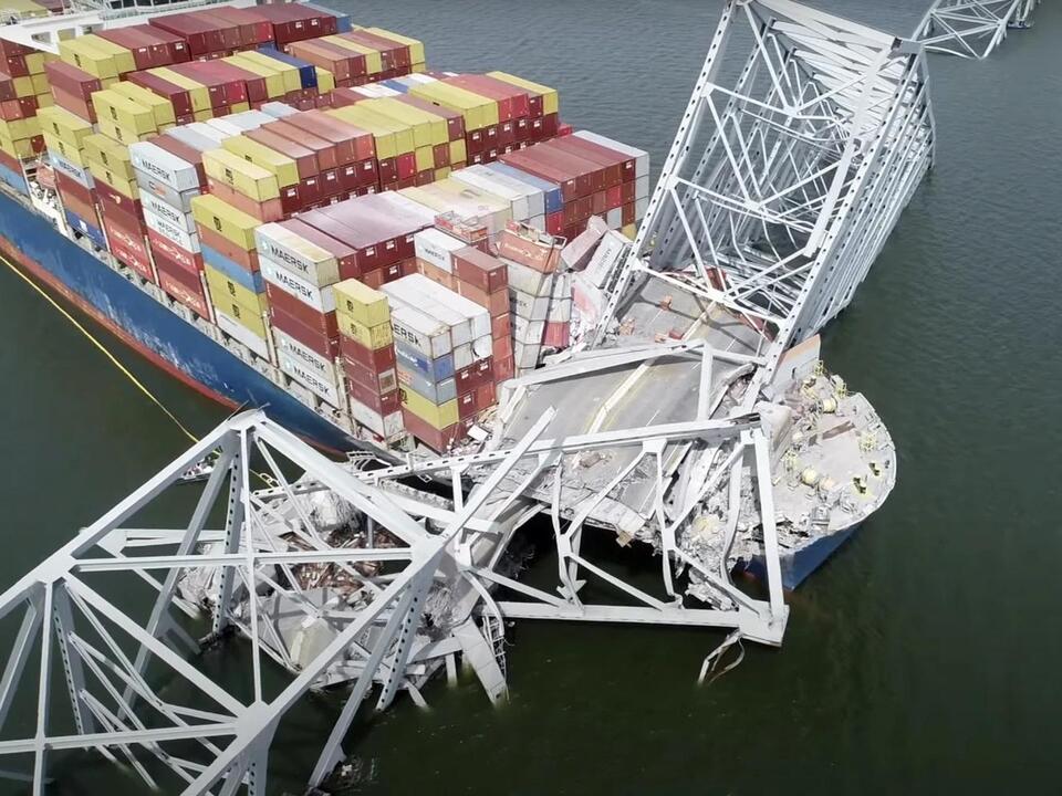 Crews carefully start removing first piece of twisted steel from ...