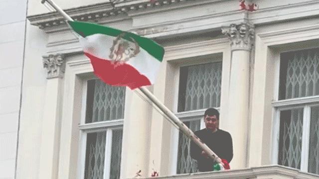 Protester scales Iranian Embassy in London, tears down regime flag ...