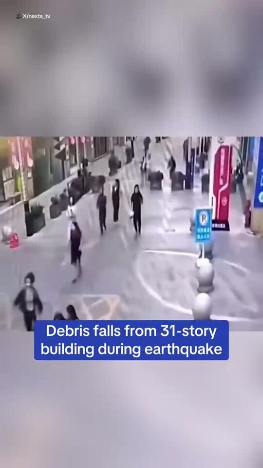 Surveillance footage captures a 31-story building crumbling as ...