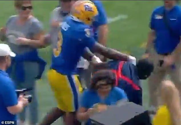 Crazy moment college football ball boy fights with opposition players ...