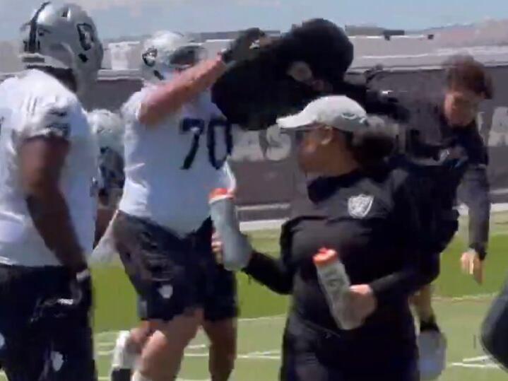 Watch as Las Vegas Raiders rookie knocks over head coach's son in first ...