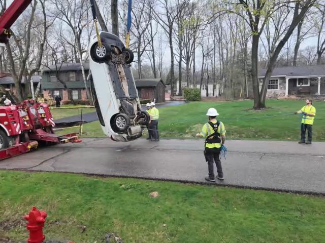 Sinkhole swallows car in Bloomfield Twp. driveway, teen believed to be ...