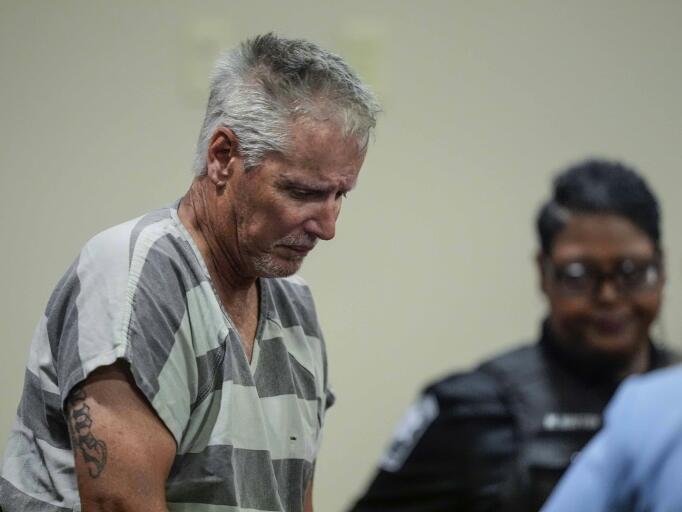 Father, son charged in US school shooting held without bond