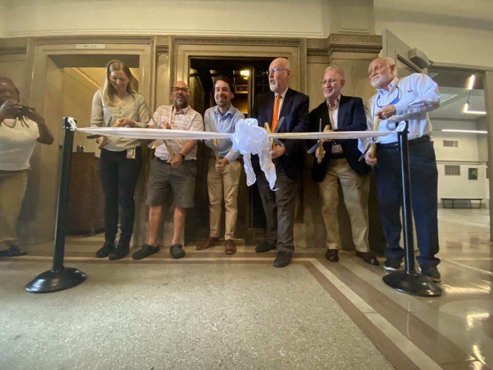 Former facilities manager Bob Robins helps Gainesville Mayor Harvey ...