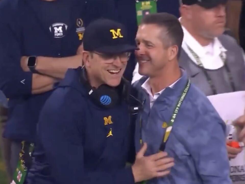Jim Harbaugh shares nice moment with brother John during title game