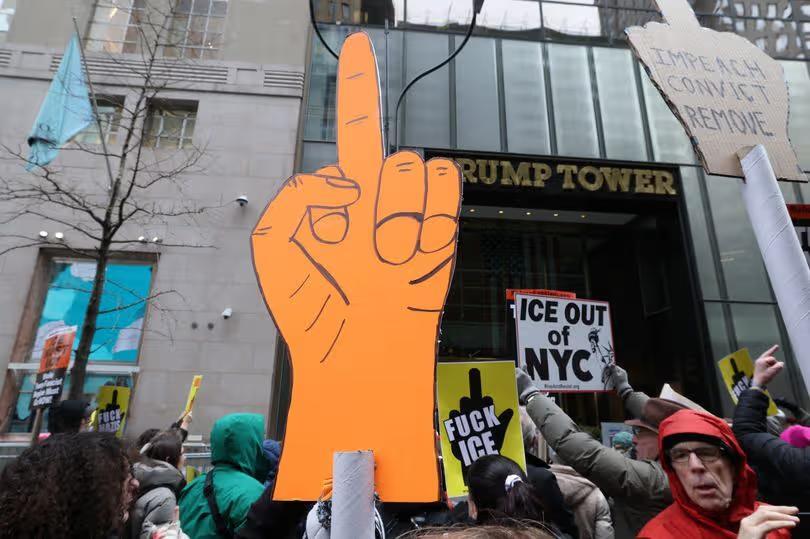 Trump gets the finger as 'flip-off' protesters swarm Trump Tower on ...