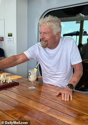 A day with billionaire Richard Branson as parties at a private beach ...