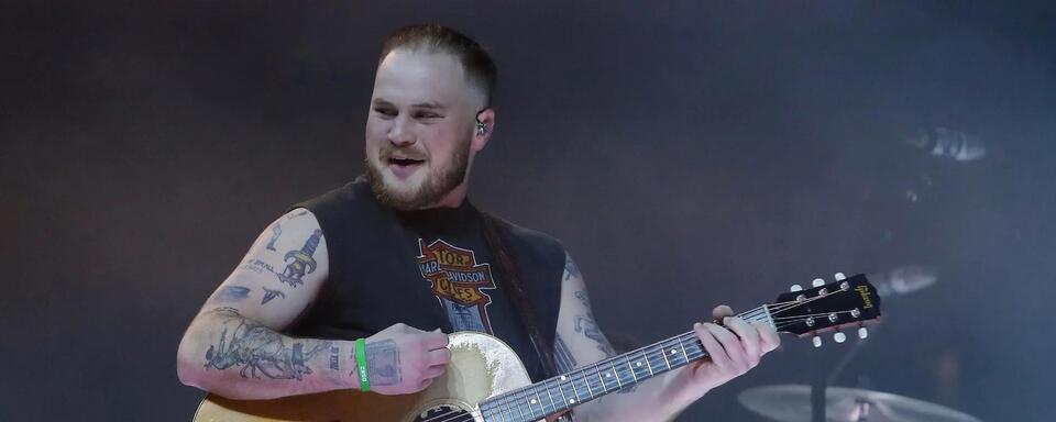 Zach Bryan and Shane Gillis Perform Surprise Show for Super Bowl Crowd ...