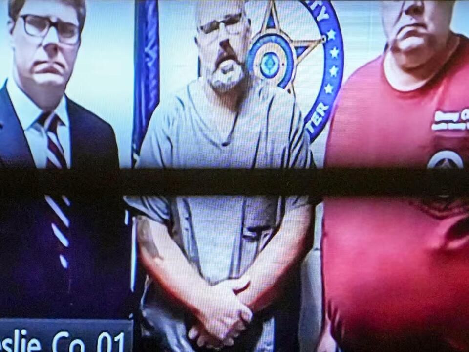 Kentucky sheriff charged in the fatal shooting of a judge pleads not guilty