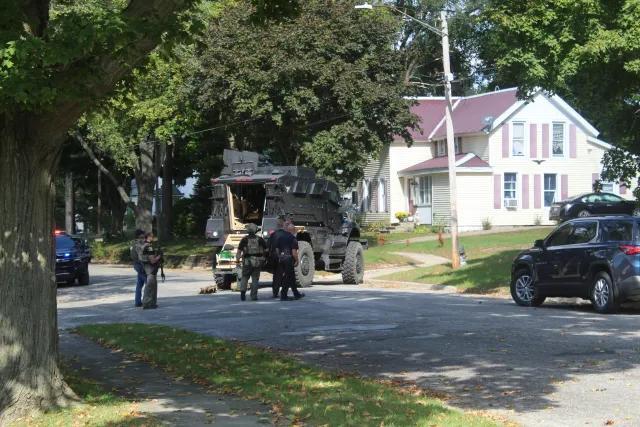 Police arrest wanted suspect day after hours-long police presence in ...