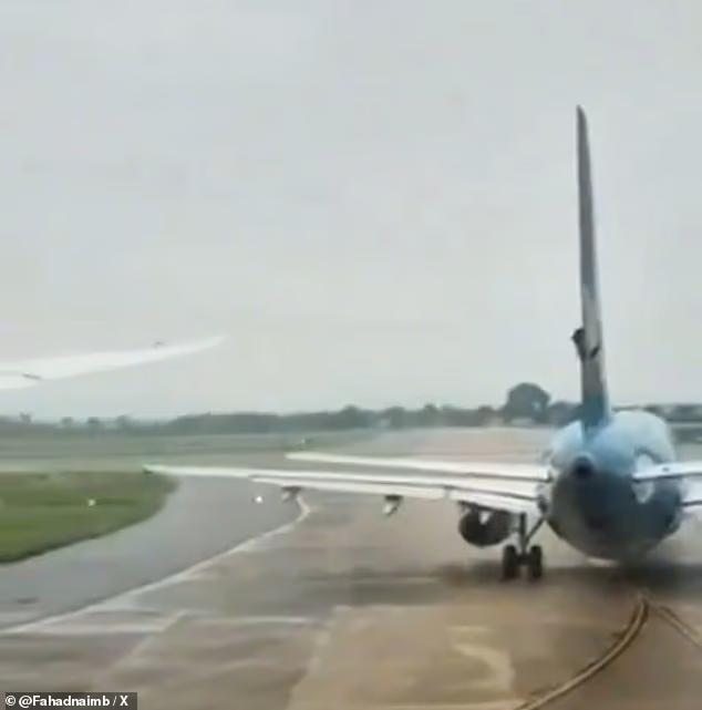 Boeing passenger plane SLICES tail of another jet on runway of major ...