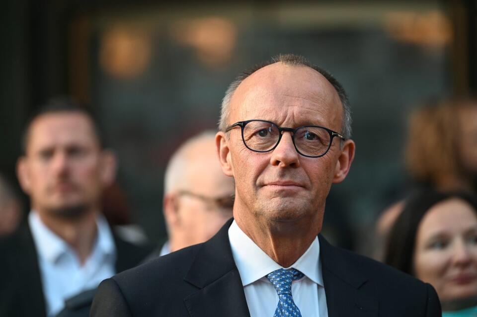 German chancellor sings at celebration, defends the 'joy' in unity - NewsBreak