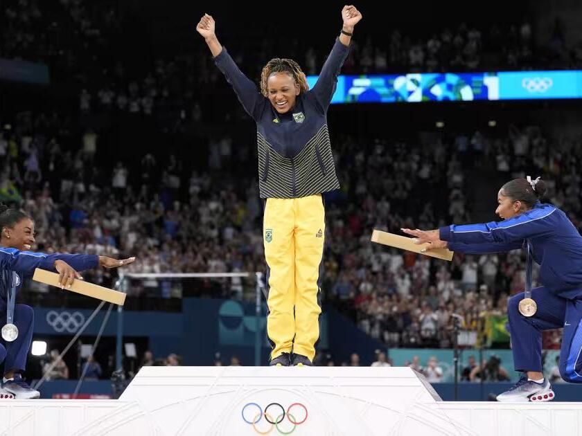 Simone Biles shares story behind bowing to Rebeca Andrade with Jordan ...